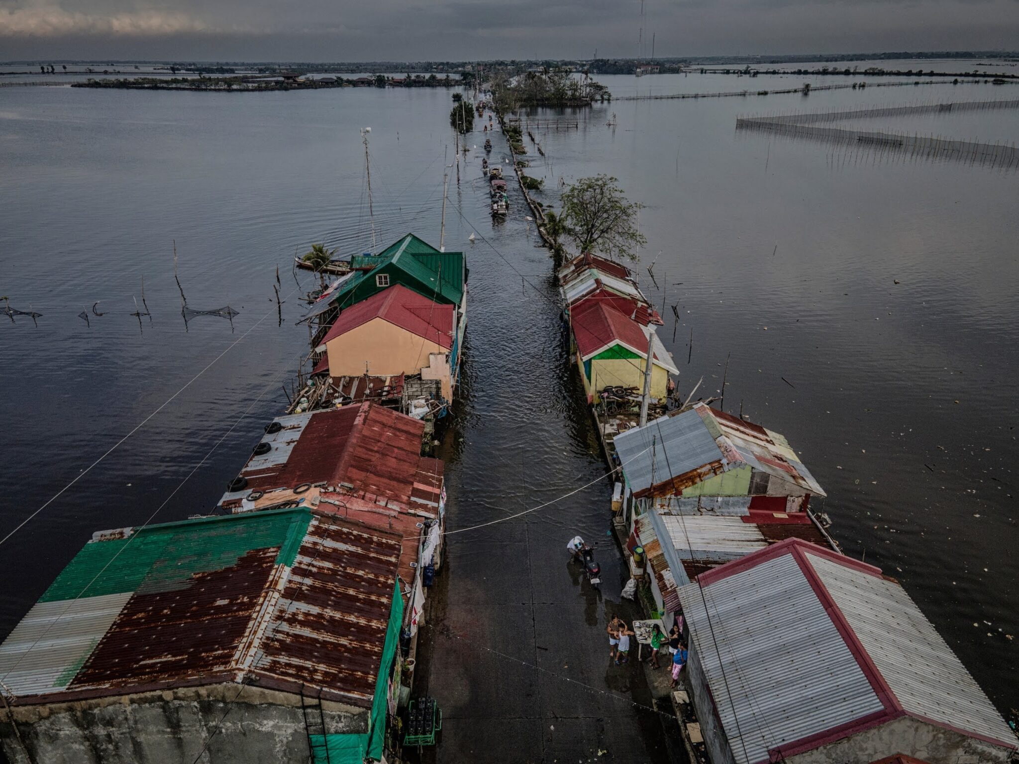 Sinking Land and Rising Seas Threaten Manila Bay’s Coastal Communities ...