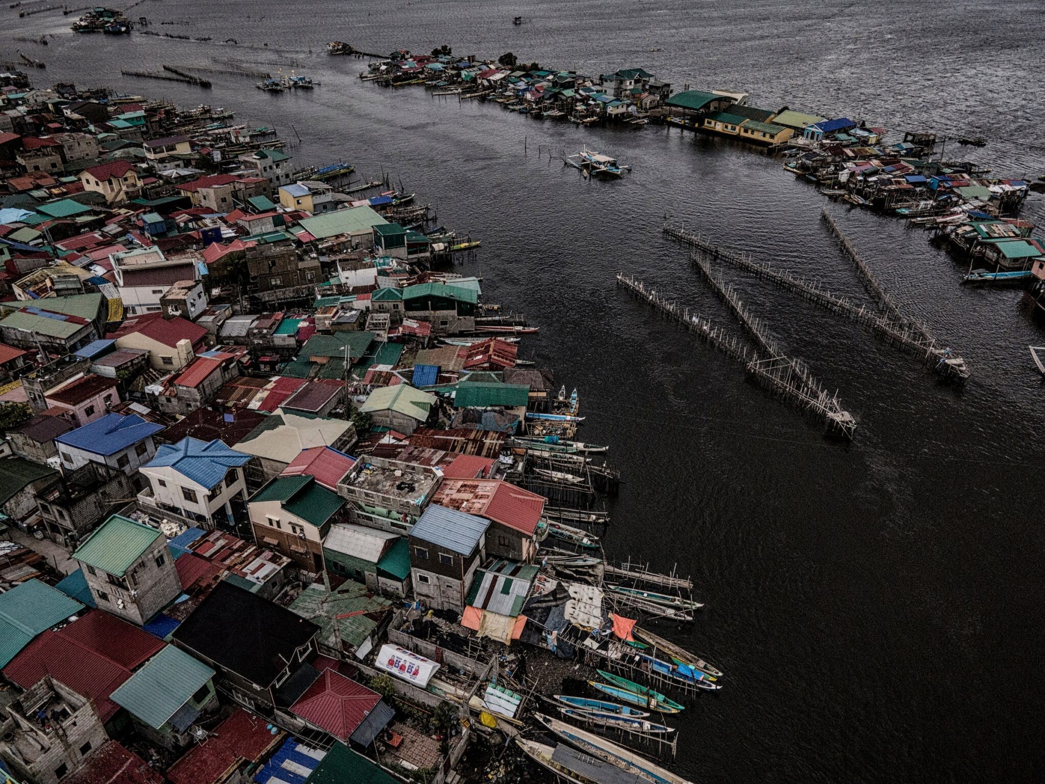 Sinking Land and Rising Seas Threaten Manila Bay’s Coastal Communities ...